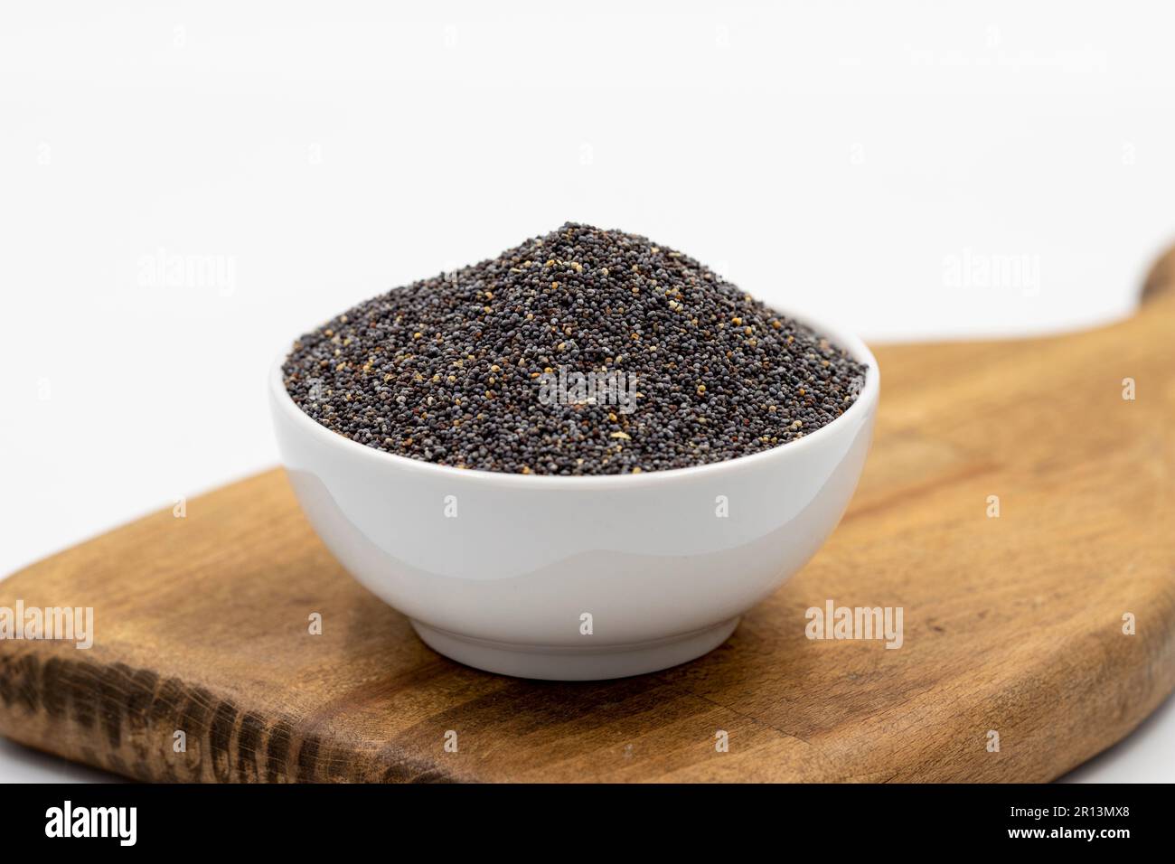 Blue poppy seeds. Spices concept. Blue poppy seeds isolated on white ...
