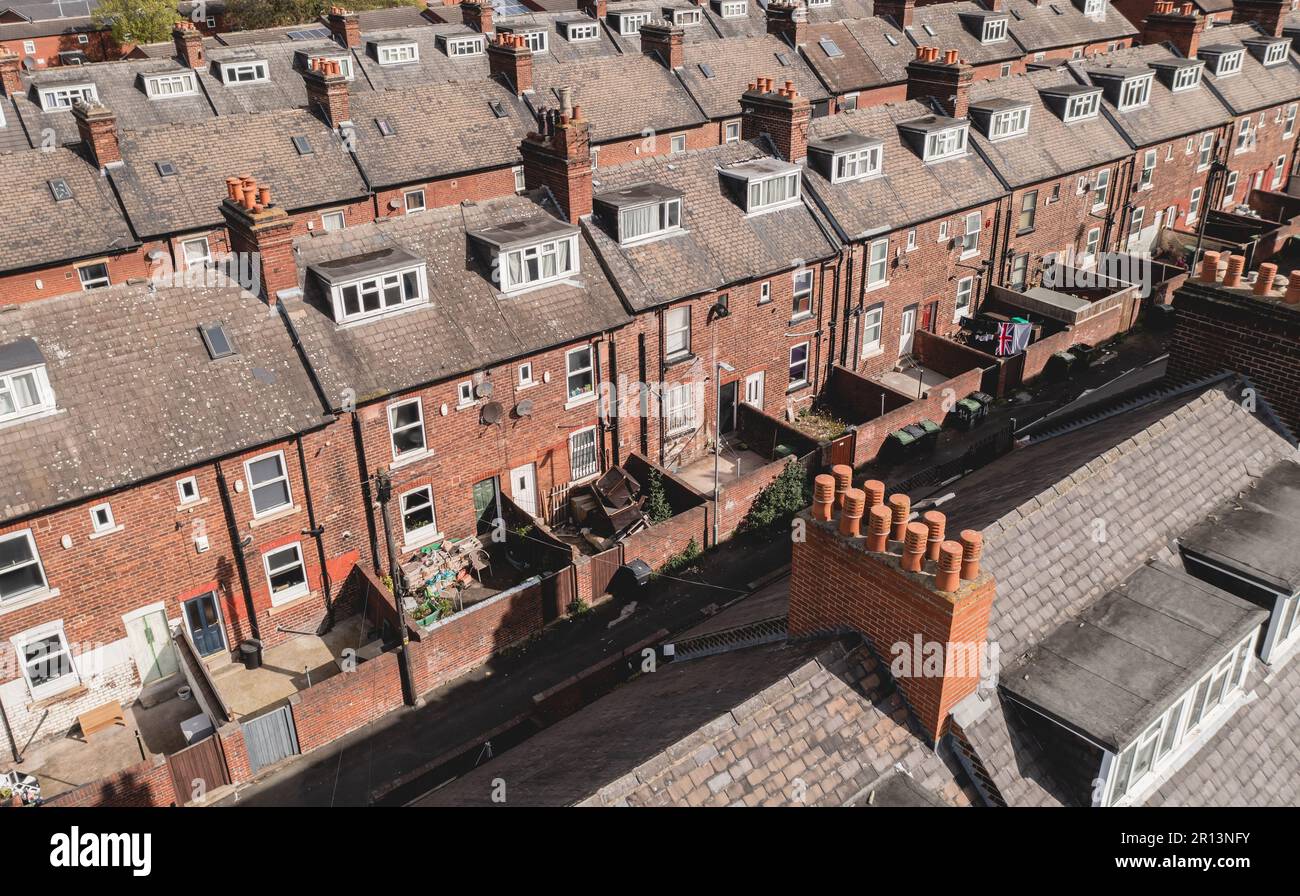 An aerial view above the rooftops of run down back to back terraced ...