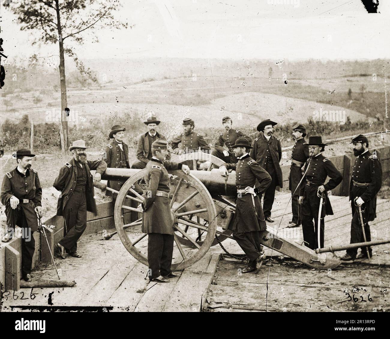 Gen. William T. Sherman, leaning on breach of gun, and staff at Federal ...