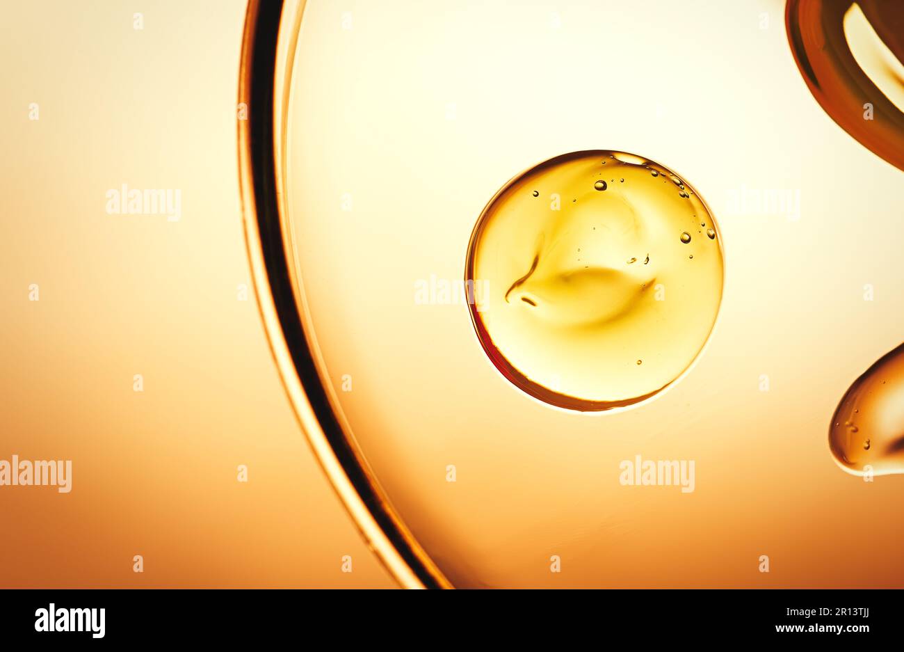 Golden gel texture on laboratory glass Stock Photo - Alamy