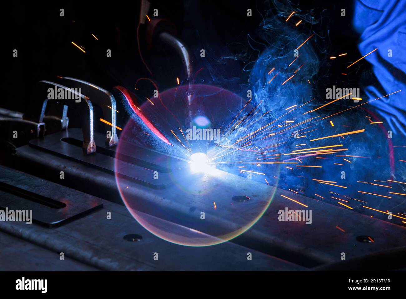Using an argon torch to weld steel and factory items with professional ...