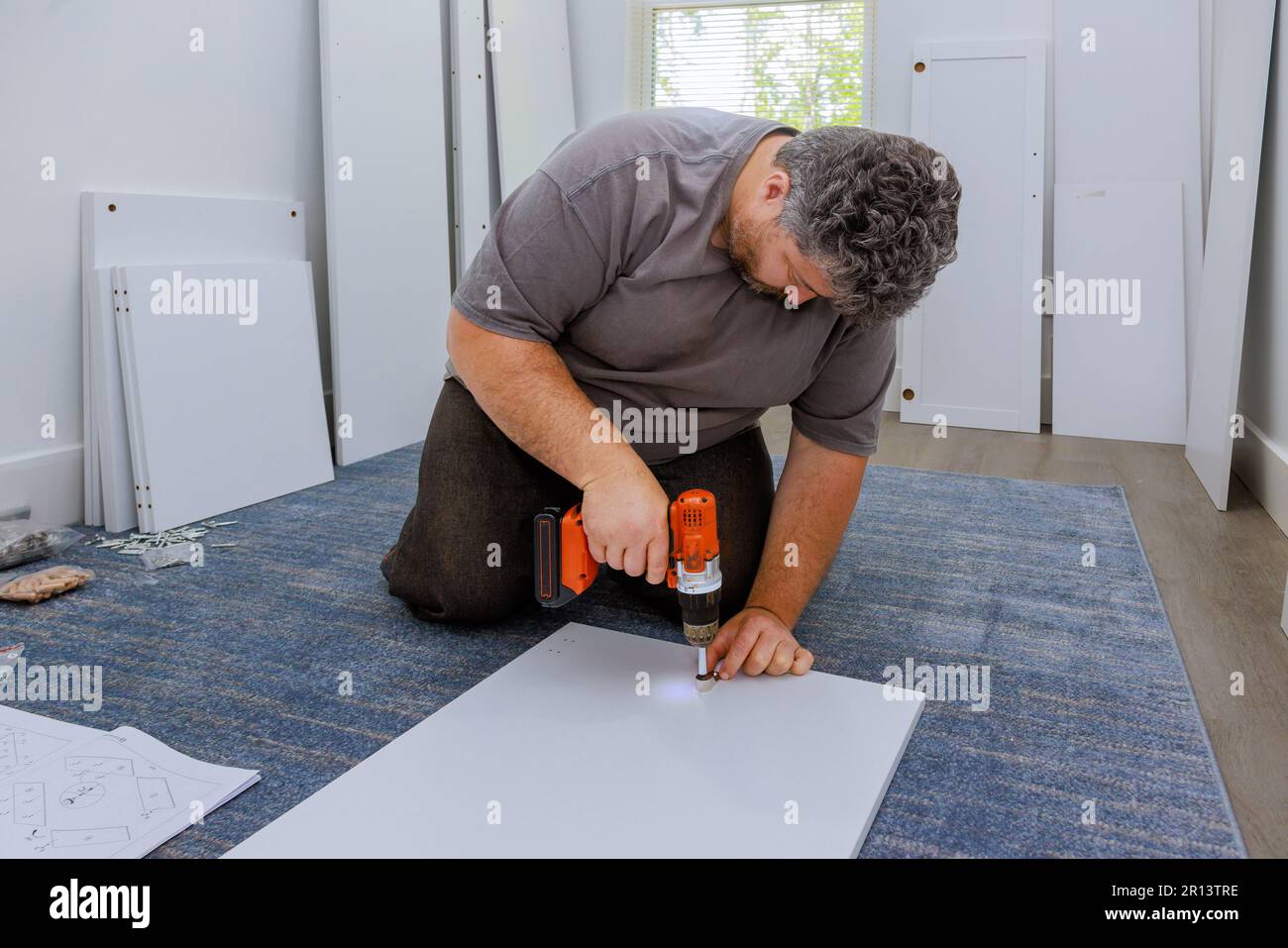 Handyman is currently assembling and installing furniture closet ...