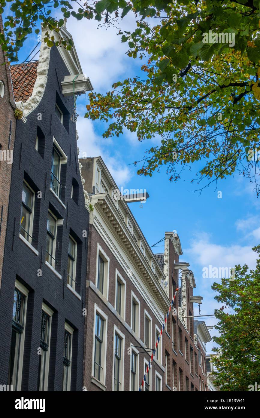 Netherlands. Sunny day in Amsterdam. Facades of authentic Dutch houses ...