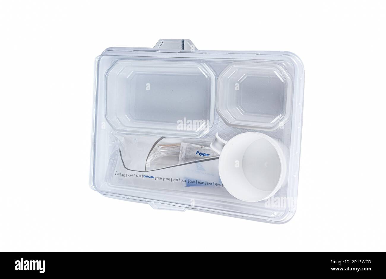 A plastic lunch box with separate compartments isolated on a white ...