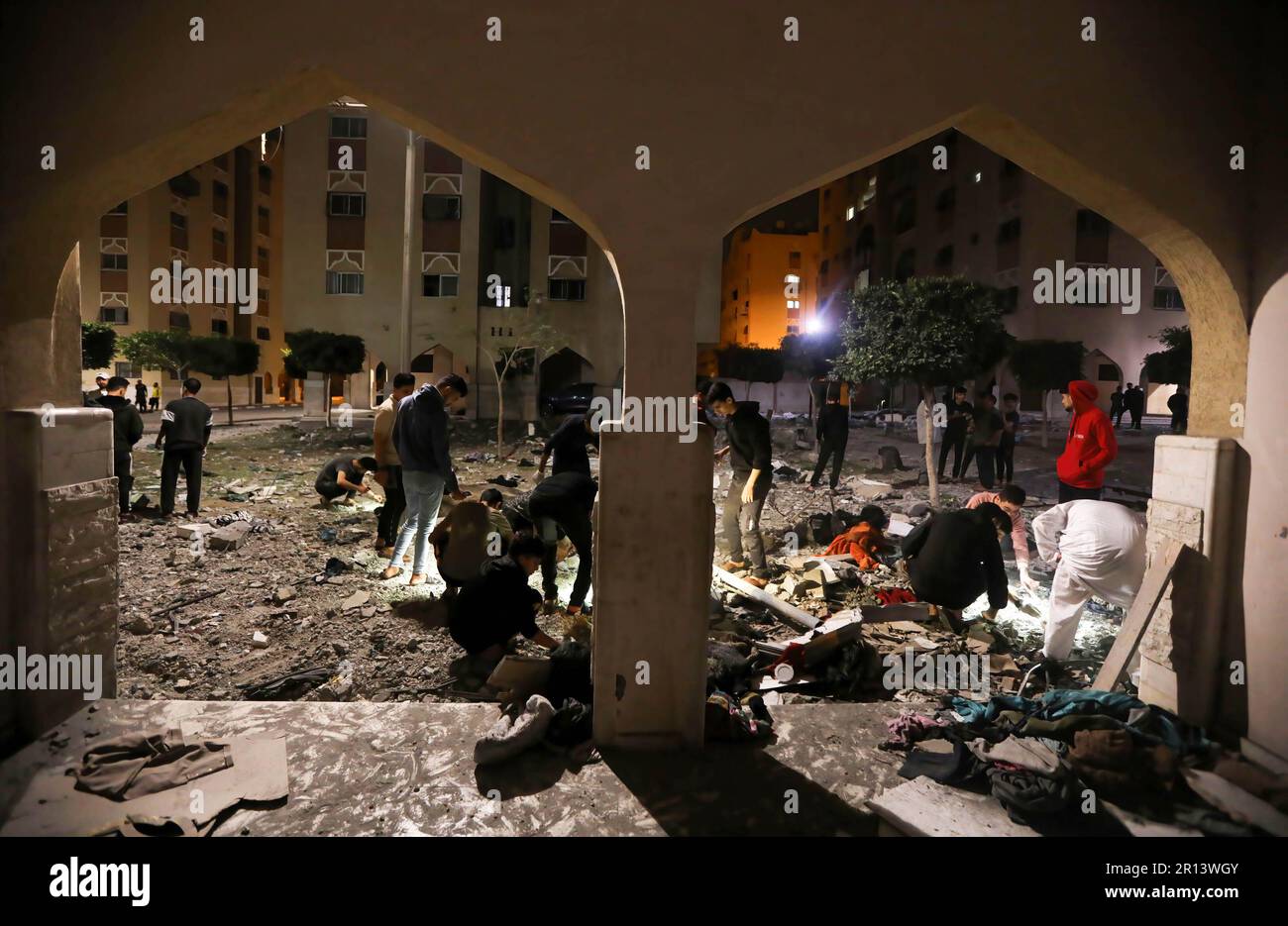 Gaza, Palestine. 11th May, 2023. Palestinians inspect the ruins of the ...
