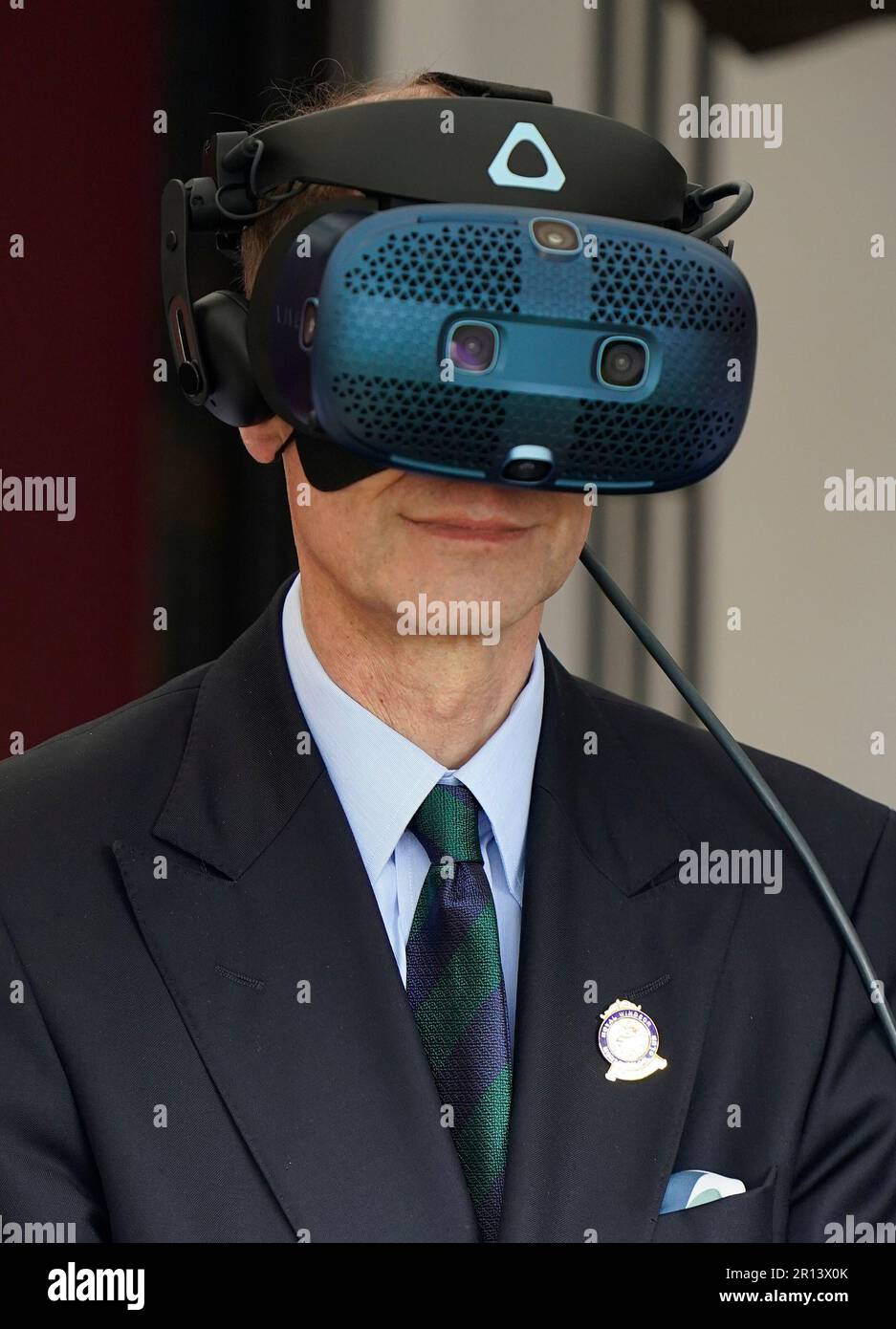 The Duke of Edinburgh uses a virtual reality headset as he tries out a ...