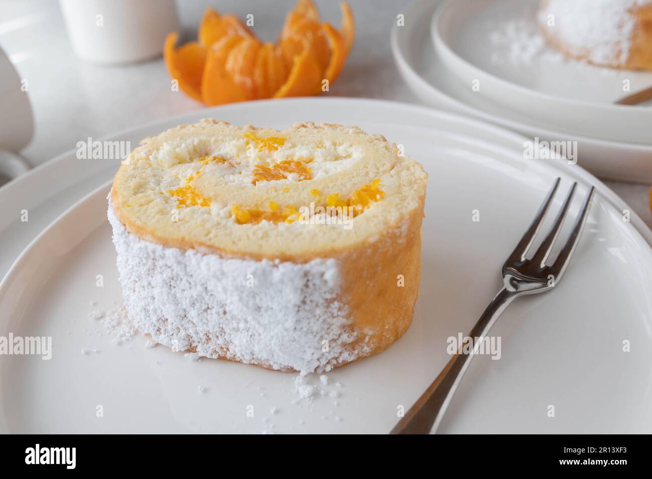 Swiss roll or biscuit roll with whipped cream and mandarin filling ...