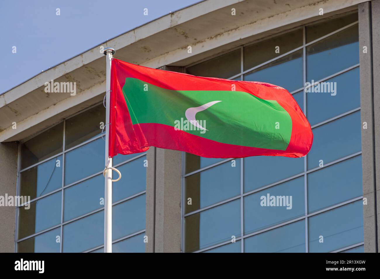 Flag of Republic of Maldives in Front of Building Stock Photo - Alamy