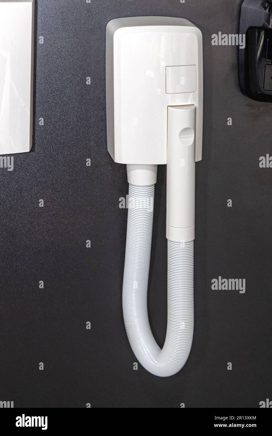 Wall Mounted Electric Hair Dryer in Hotel Bathroom Stock Photo - Alamy