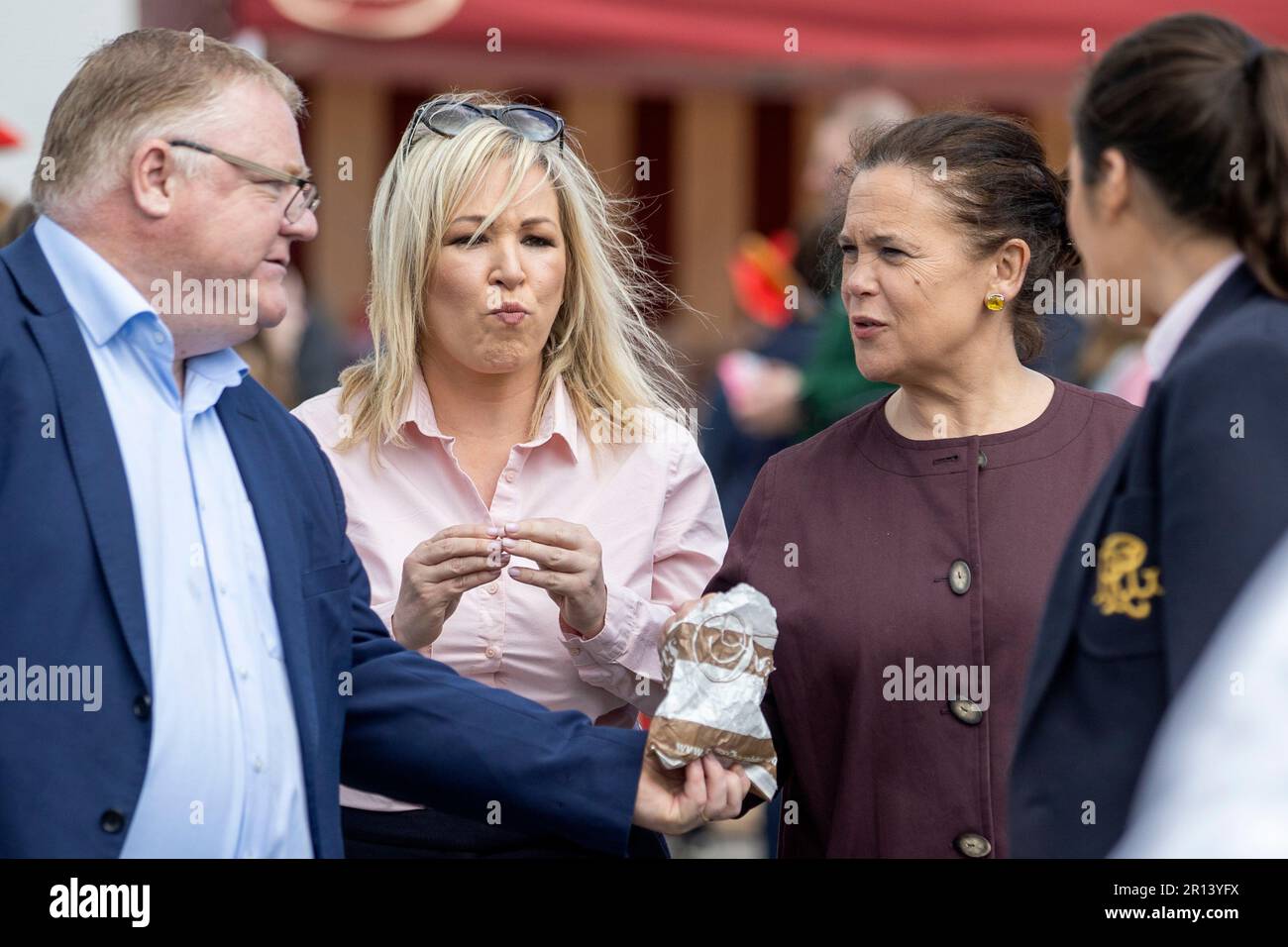 Sinn Fein MLA Declan McAleer shares a bag of sweets with party colleagues Michelle O'Neill, Mary ...
