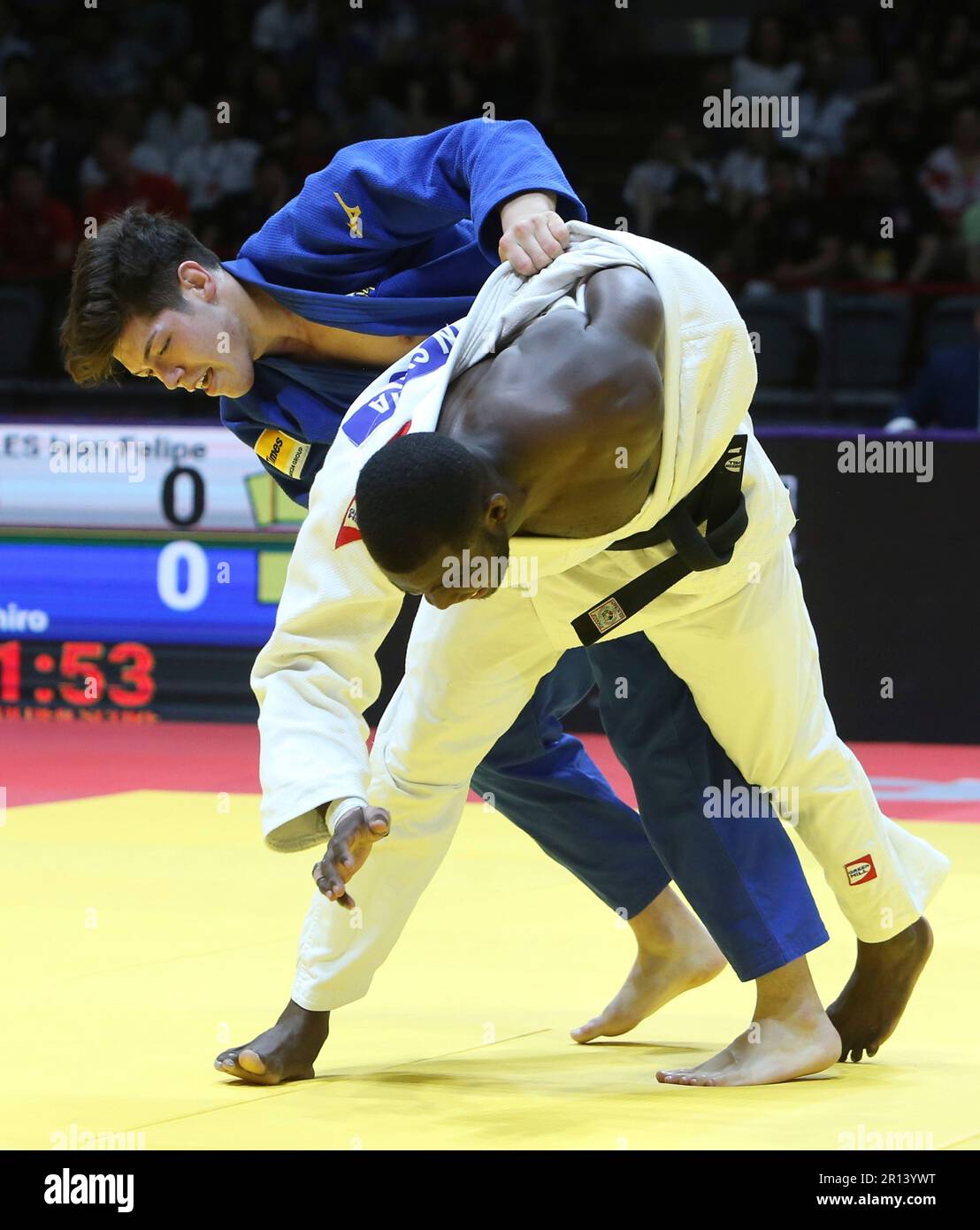 Sanshiro Murao of Japan, in blue, and Ivan Felipe Silva Morales of Cuba ...