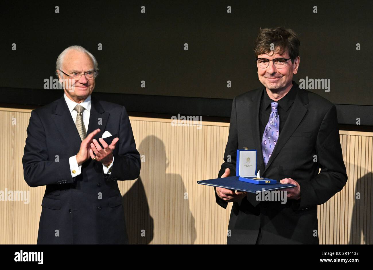 Sweden's King Carl Gustaf applauds after awarding the Crafoord Prize to ...