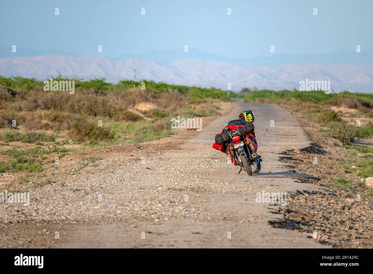 Honda 125 bike park on beach road Karachi Stock Photo - Alamy