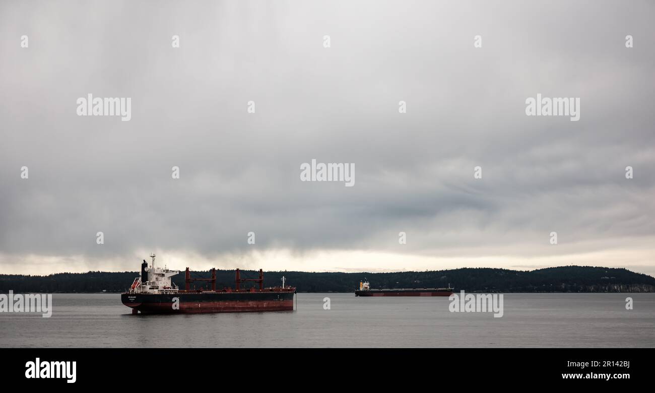 An ocean going cargo ship sits at its mooring outside of Nanaimo BC to ...