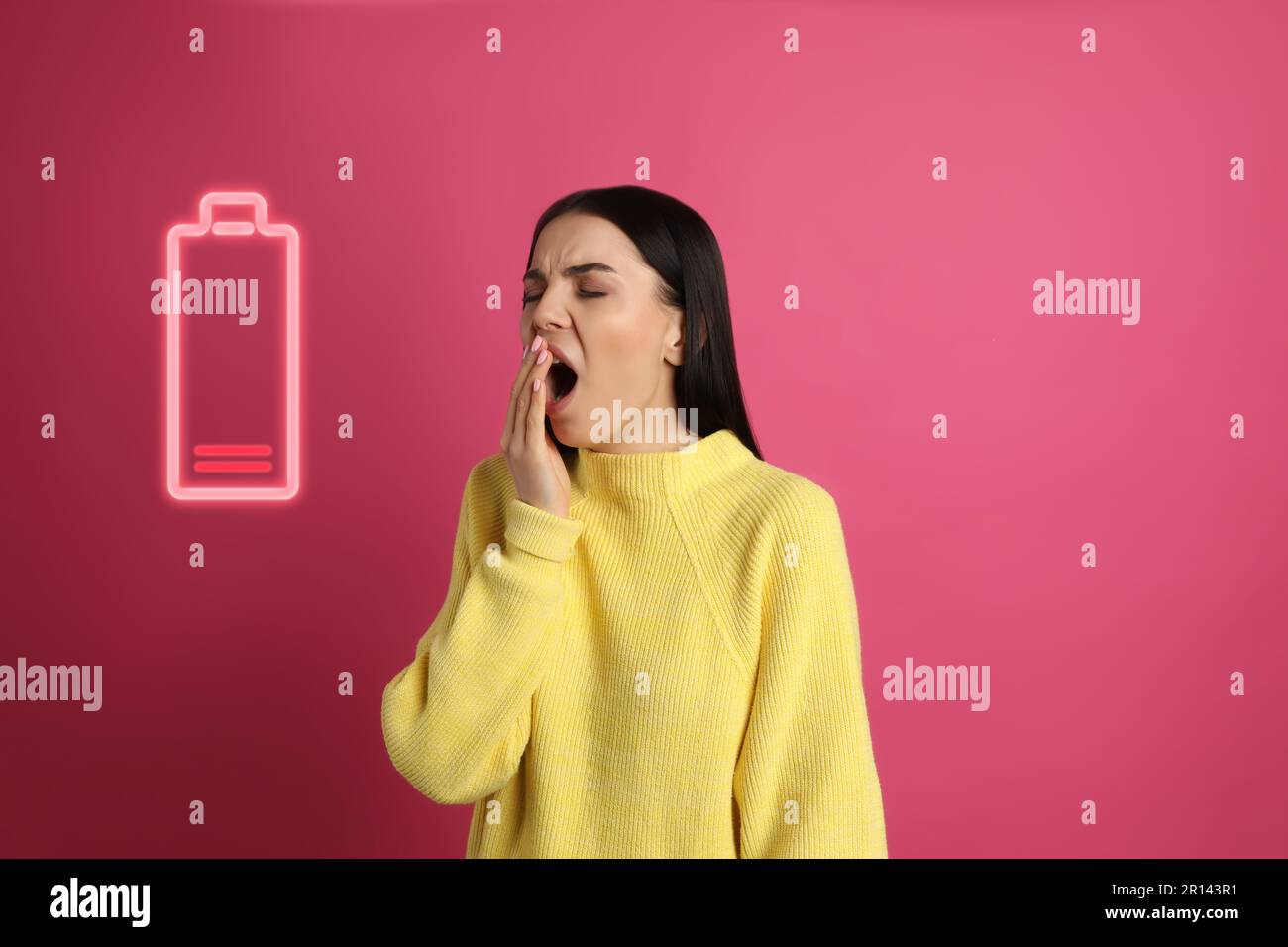 Tired woman yawning and illustration of discharged battery on pink ...