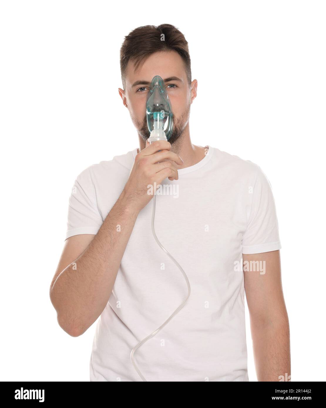 Man using nebulizer for inhalation on white background Stock Photo - Alamy