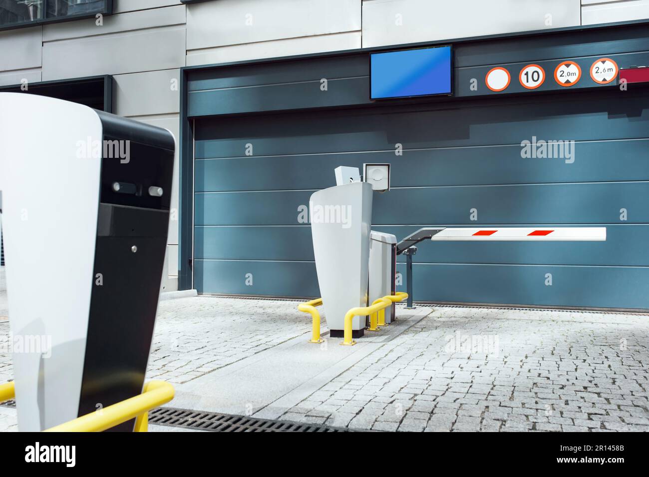 Parking meters on city street near buildings Stock Photo - Alamy