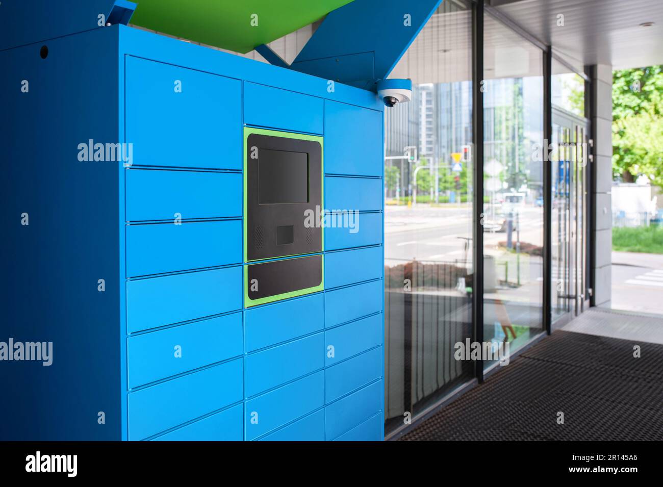Parcel locker with many postal boxes near building outdoors Stock Photo ...