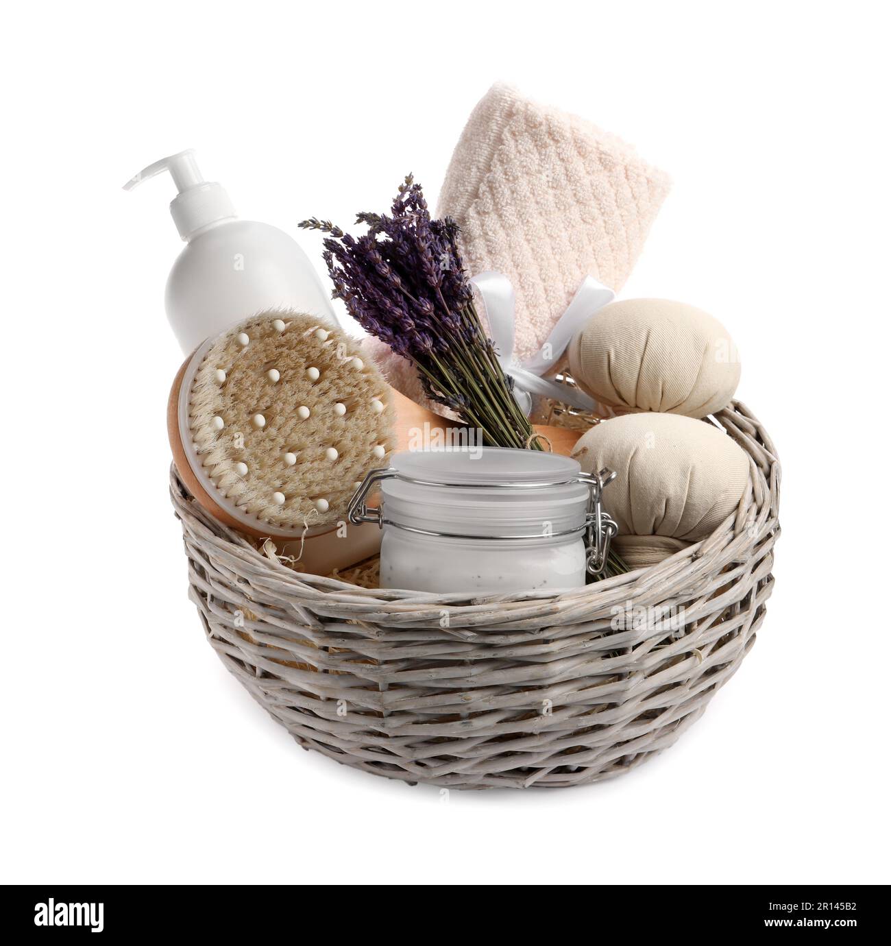 Spa gift set of different luxury products in wicker basket on white ...