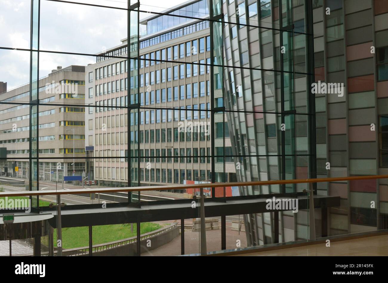 Beautiful city street with buildings, view through big glass windows ...