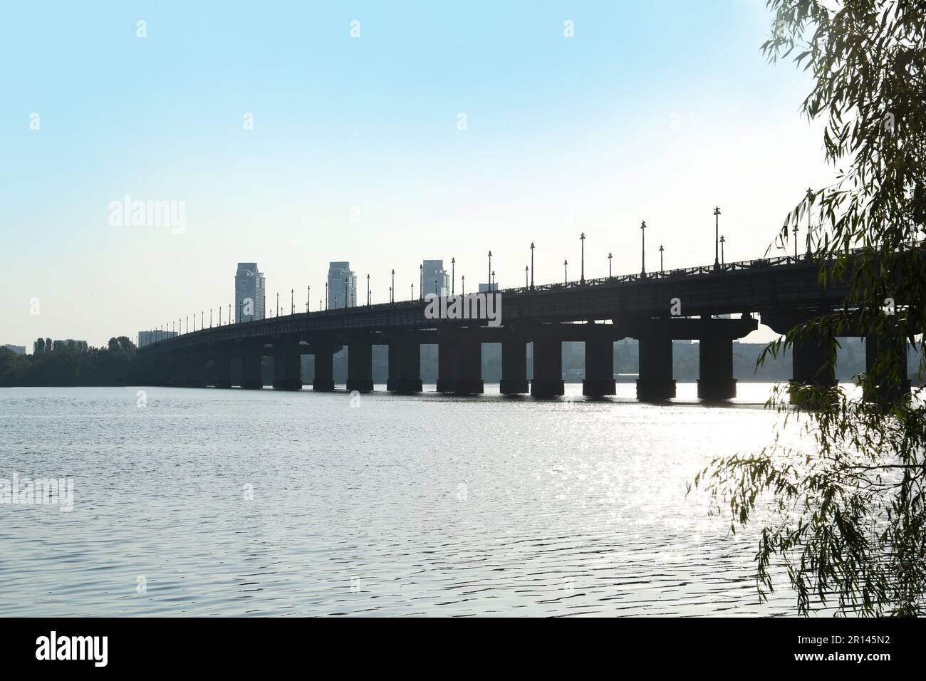 Beautiful view of beam bridge over river on sunny day Stock Photo - Alamy