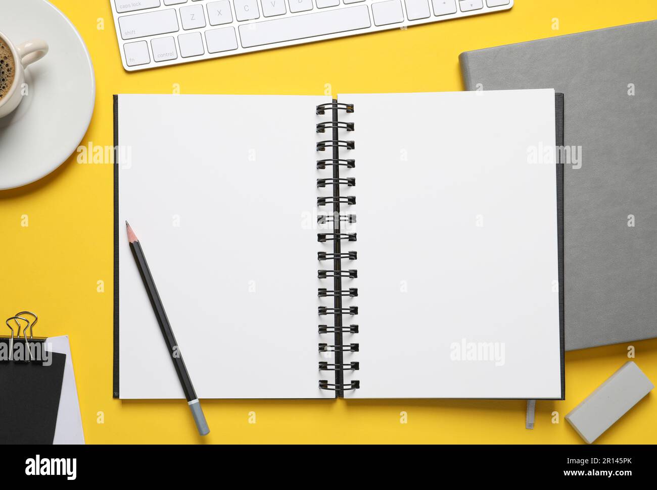 Flat lay composition with stylish notebooks on yellow background Stock ...