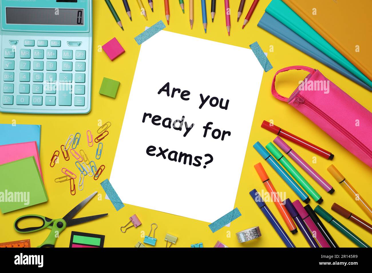 Paper with phrase Are You Ready For Exams and stationery on yellow ...
