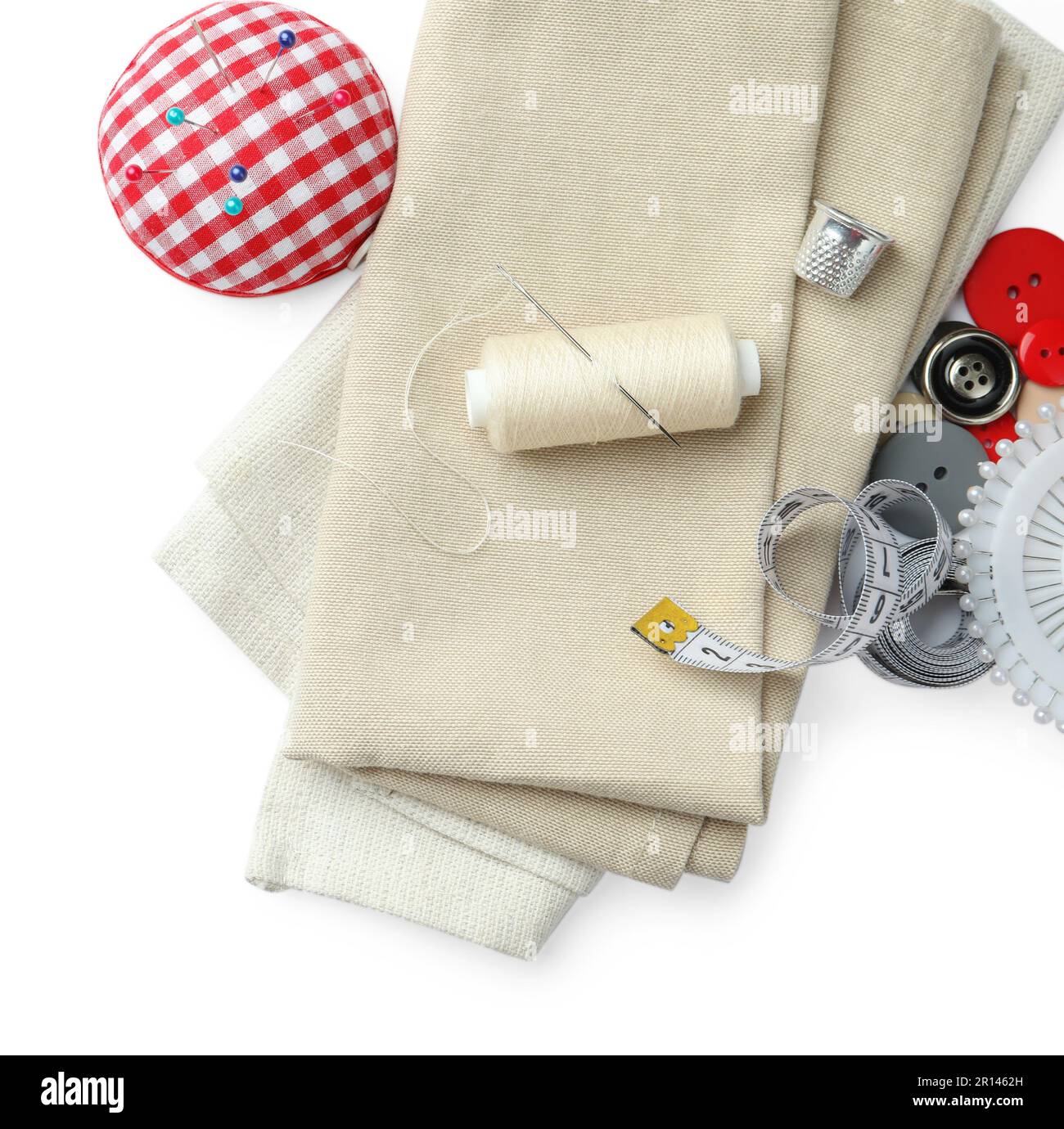 Spool of thread and sewing tools on white background, top view Stock ...