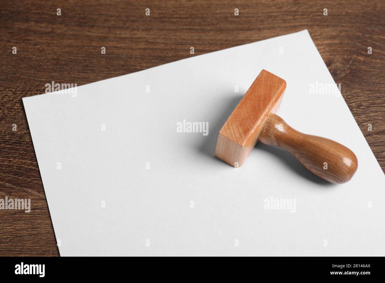 Blank sheet of paper and visa stamp on wooden table Stock Photo - Alamy