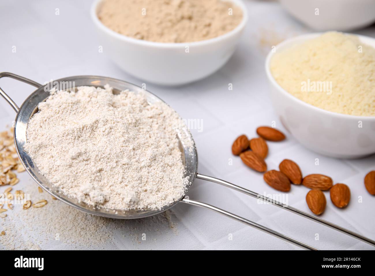 Different types of flour on tiled table, closeup Stock Photo - Alamy