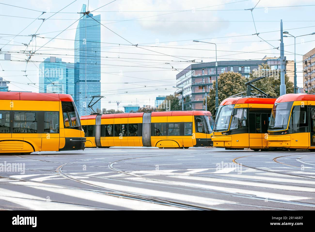 Modern trams on city street. Public transport Stock Photo - Alamy