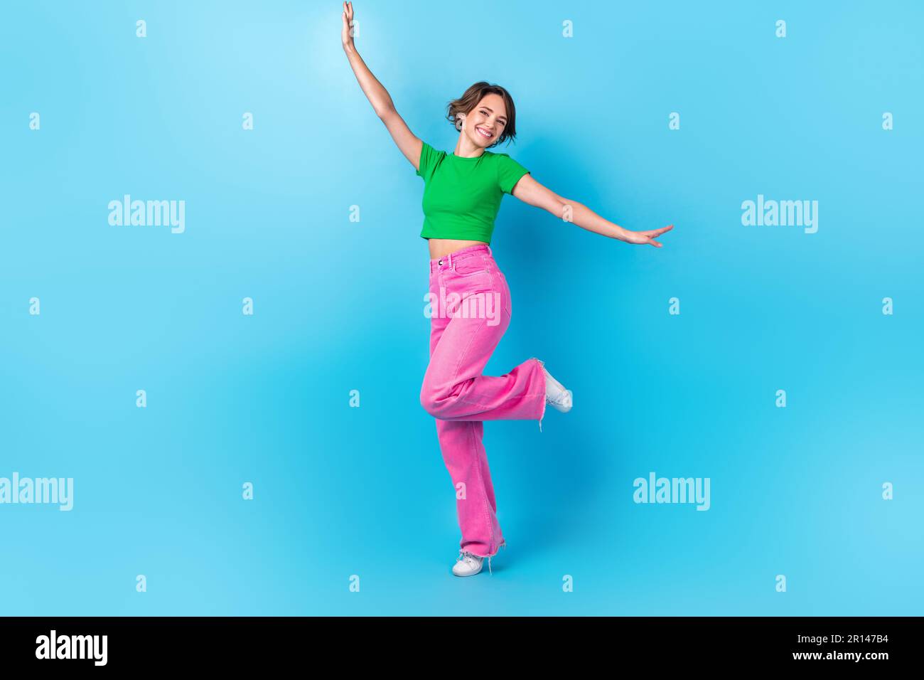 Full length cadre of smiling happy good mood girl dancing active have ...