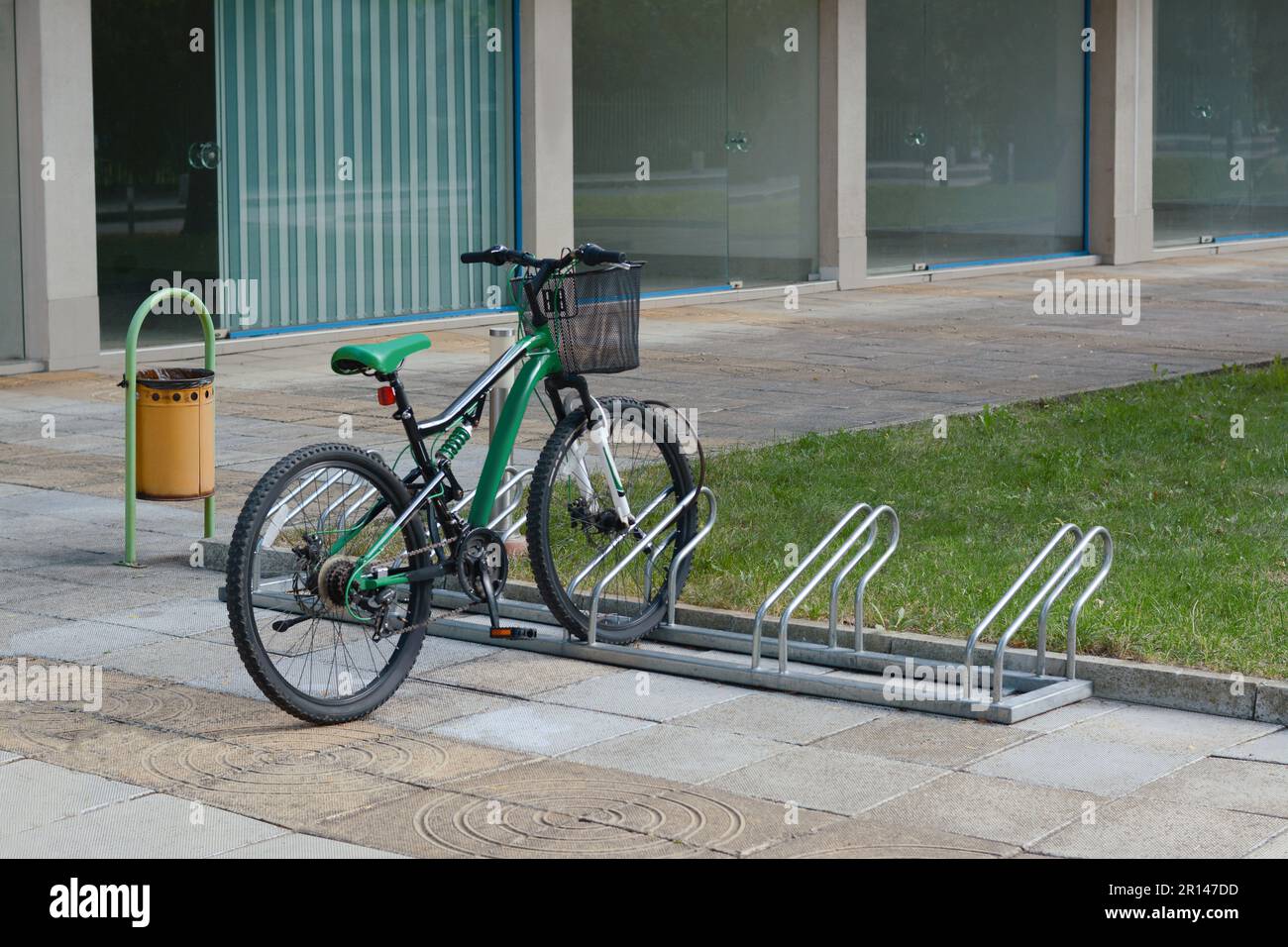 Metal bike parking rack with bicycle on city street Stock Photo - Alamy