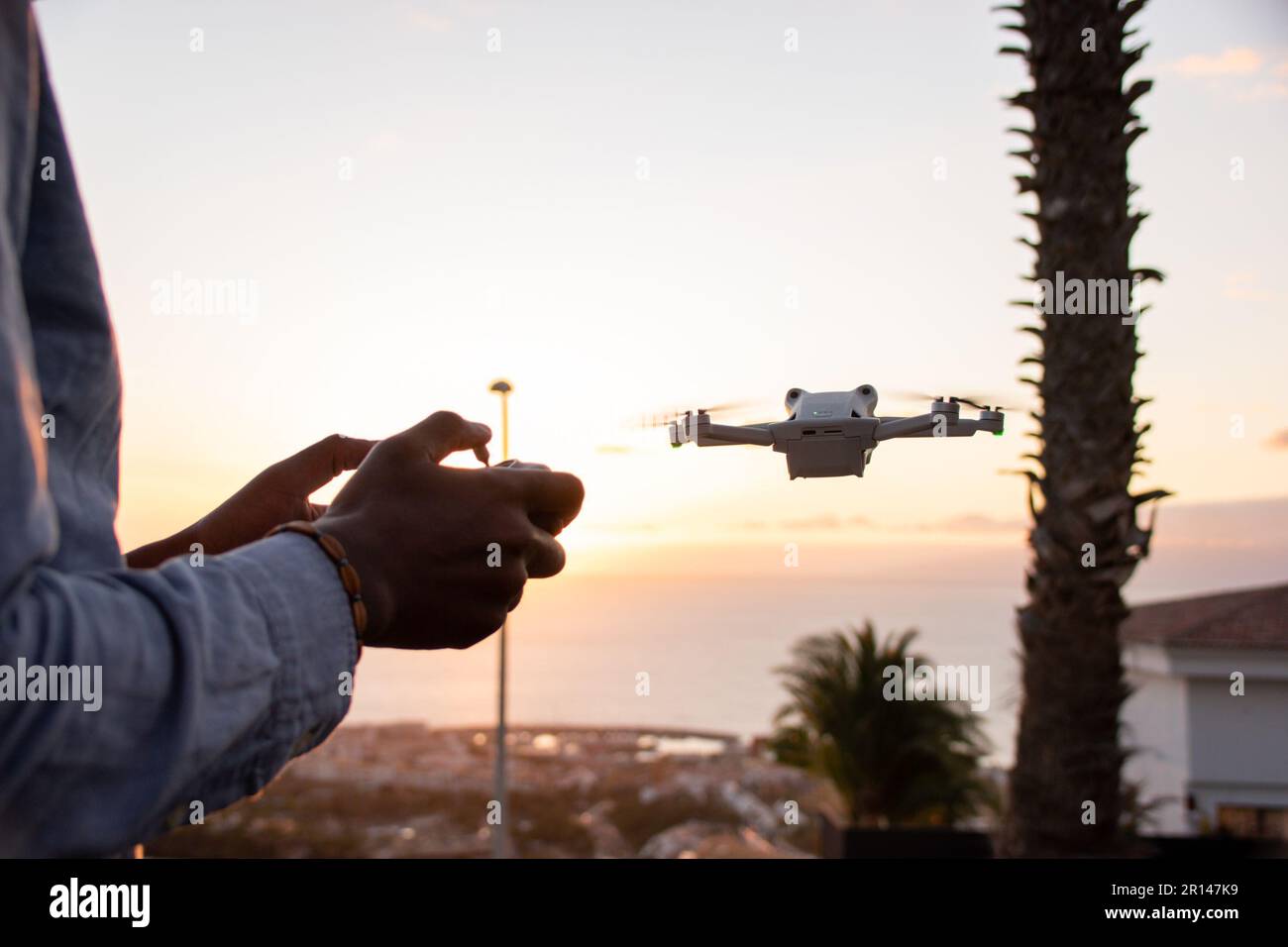 Close up of an African American man's hands controlling his drone at ...