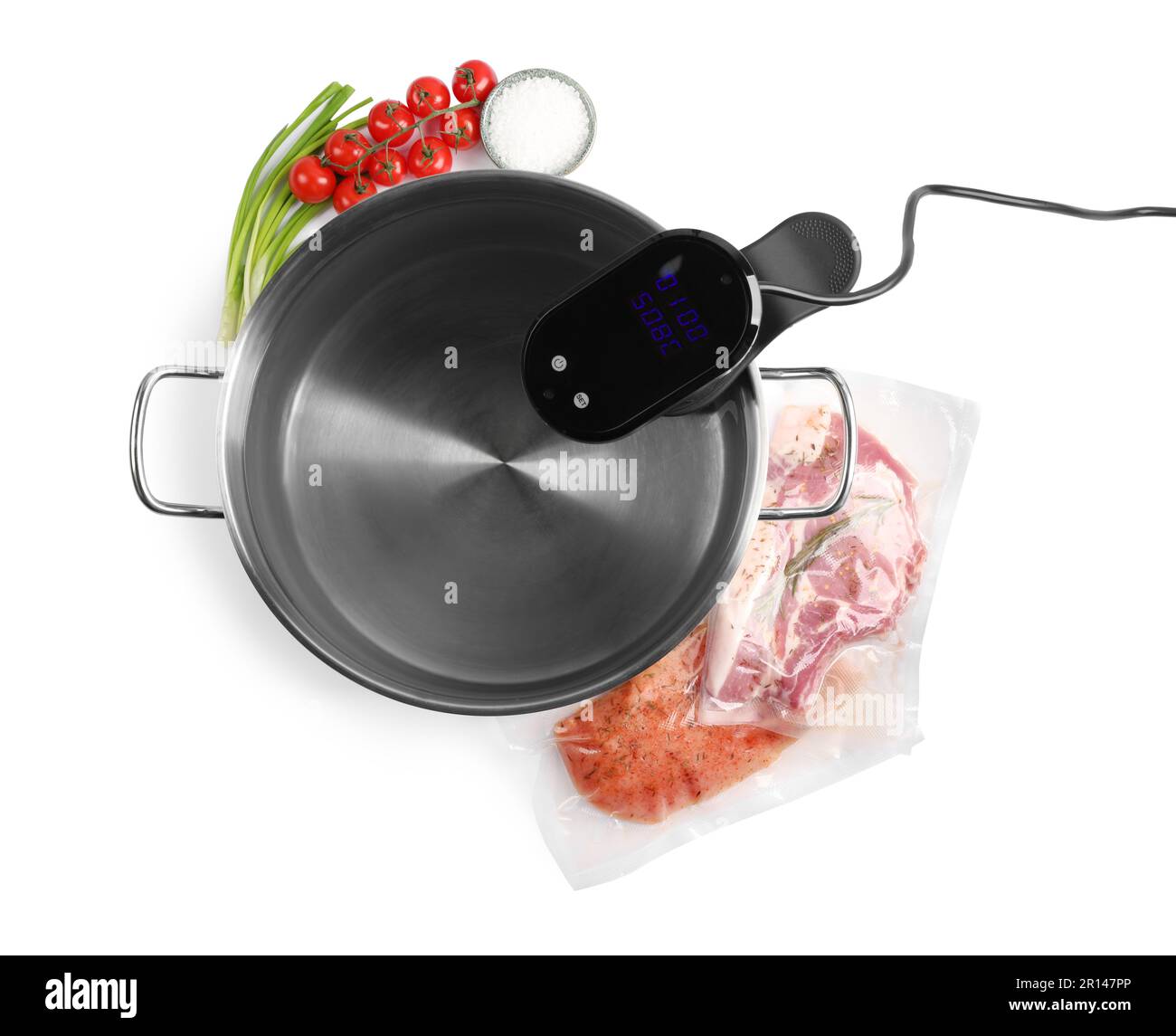Thermal immersion circulator in pot and ingredients on white background ...