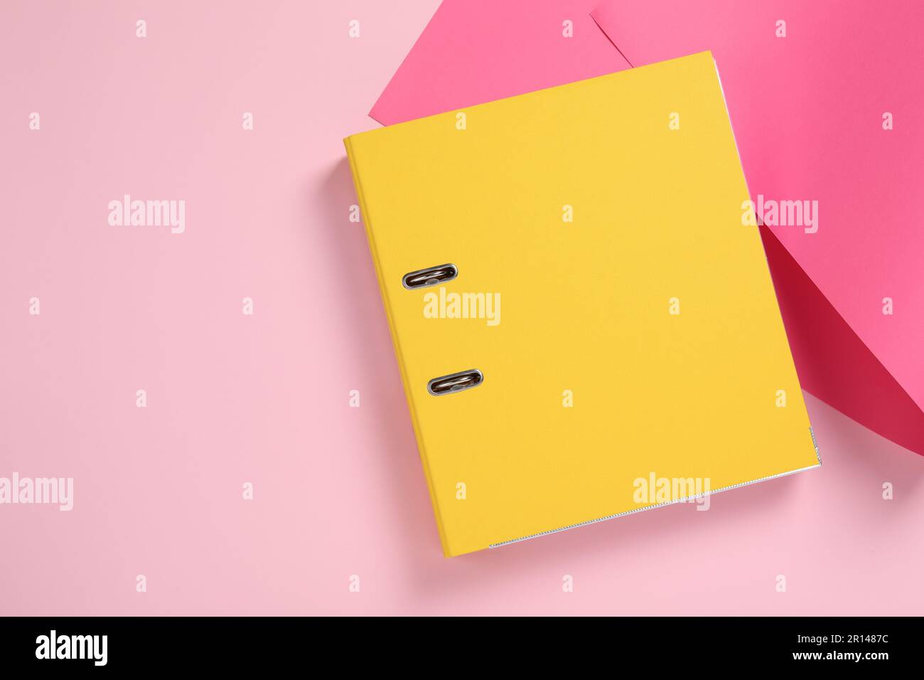 Yellow office folder on pink background, top view. Space for text Stock ...