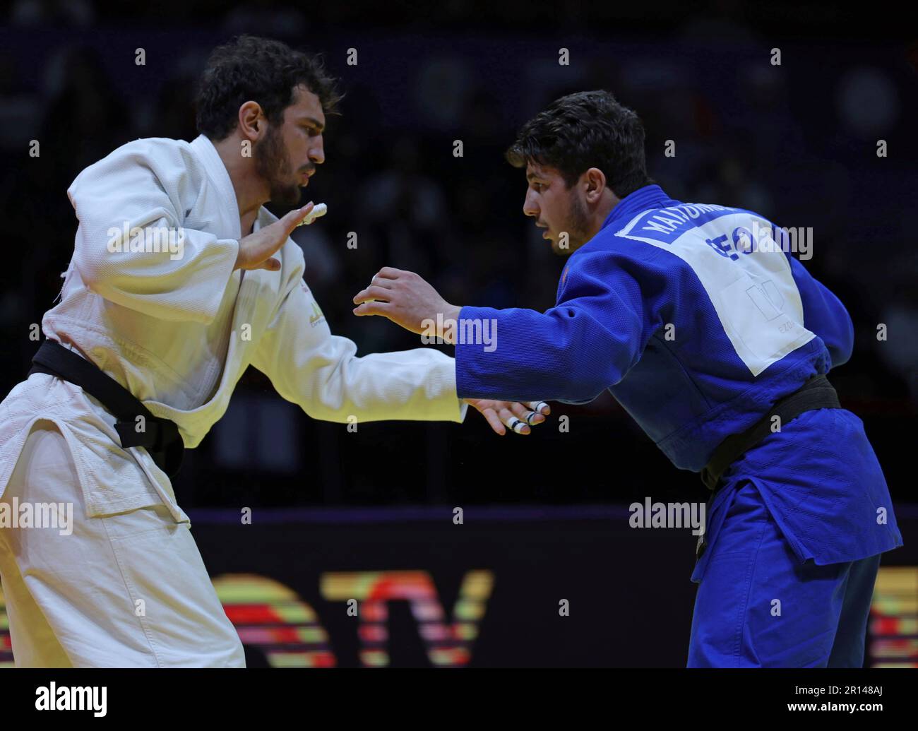 Georgia's Lasha BEKAURI (white) and Luka MAISURADZE (blue) compete ...