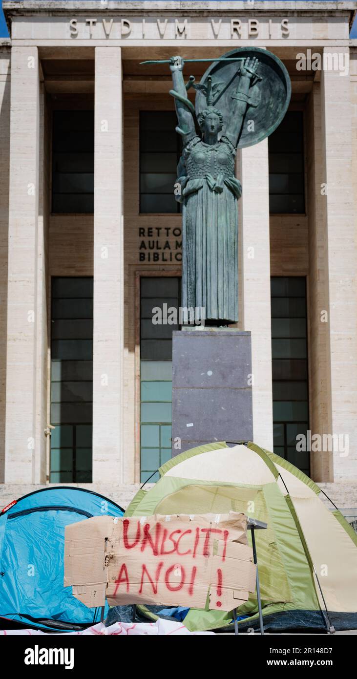A group of students engage in discussion during a protest over rising ...