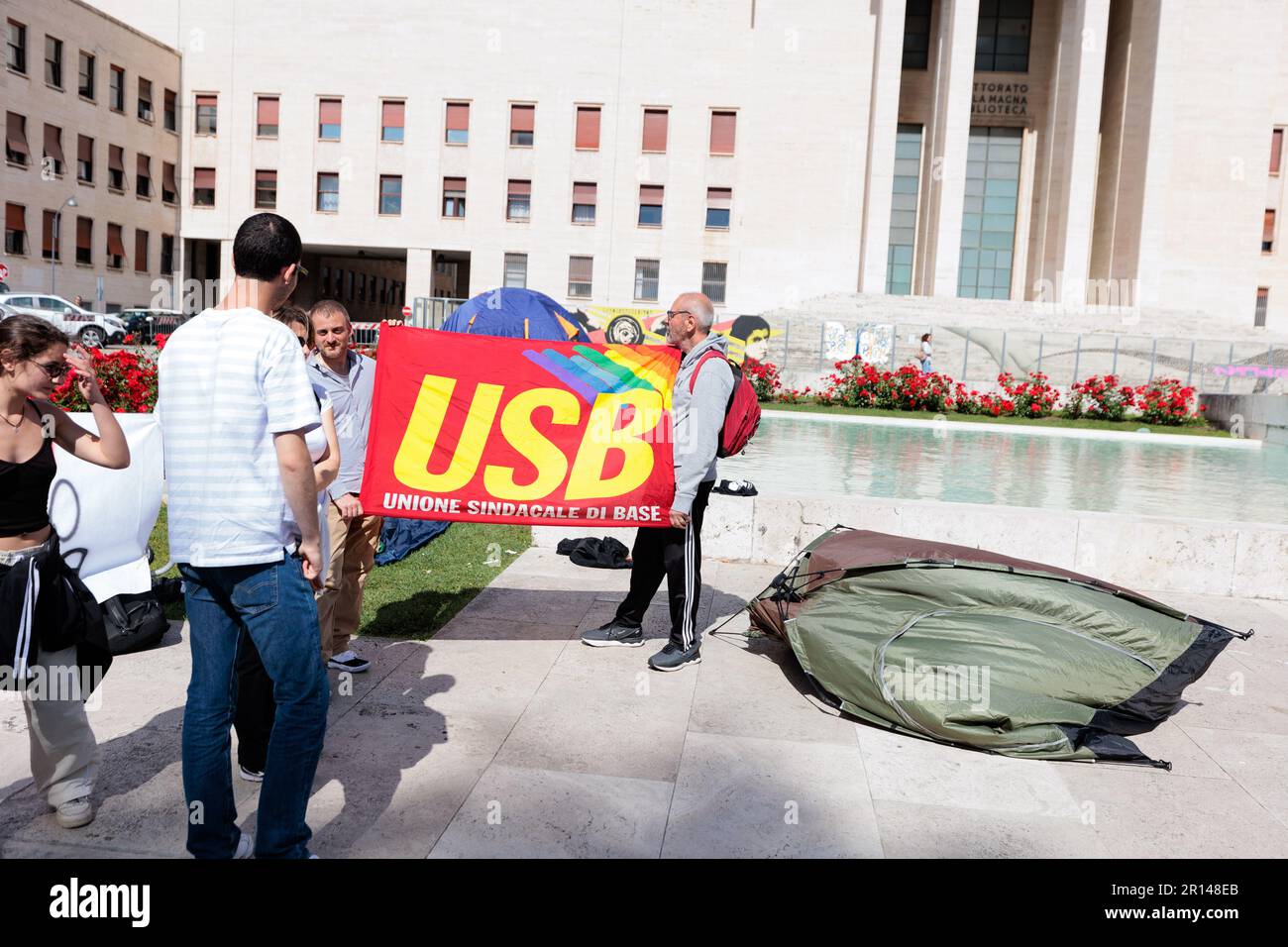 A group of students engage in discussion during a protest over rising ...