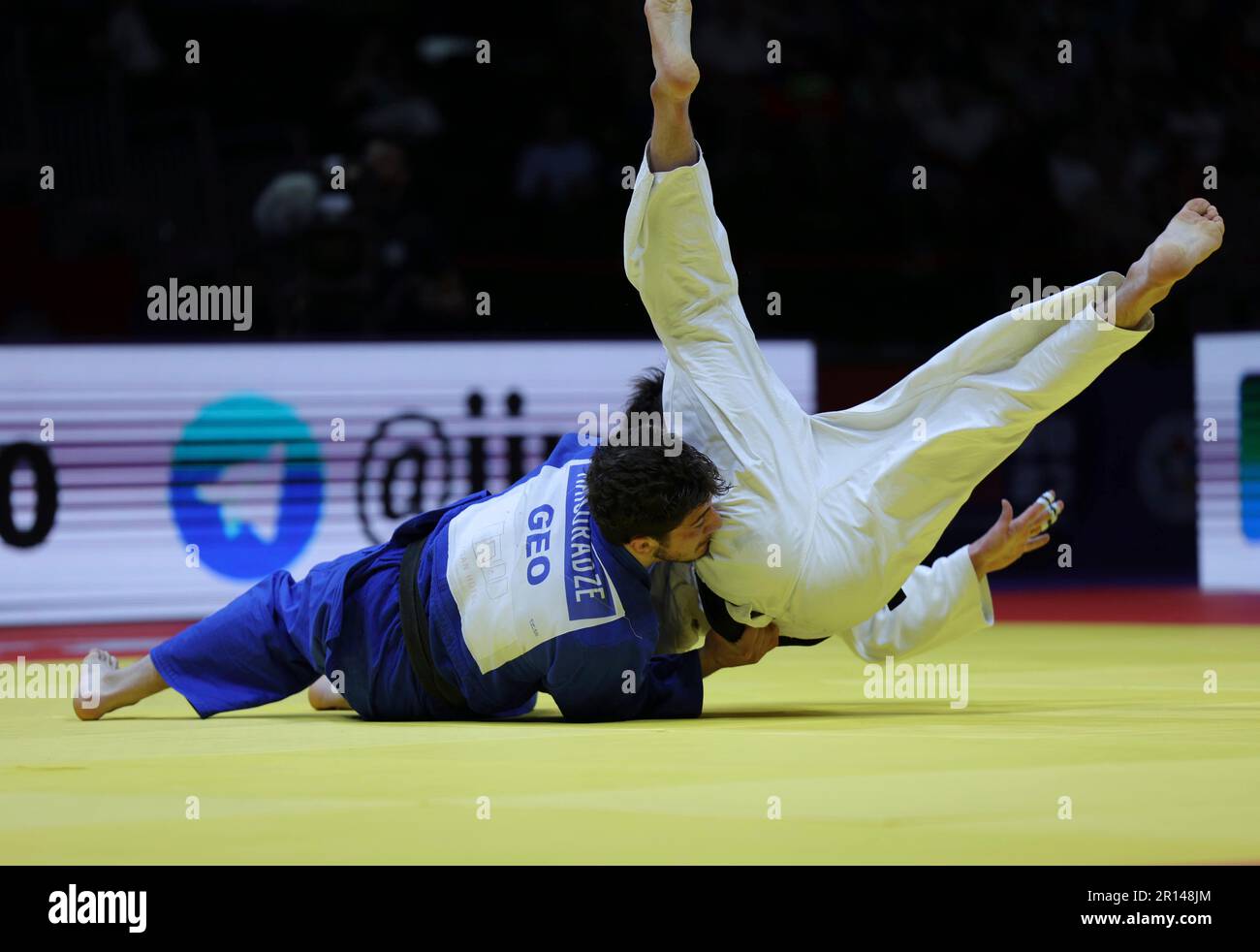 Georgia's Lasha BEKAURI (white) and Luka MAISURADZE (blue) compete ...