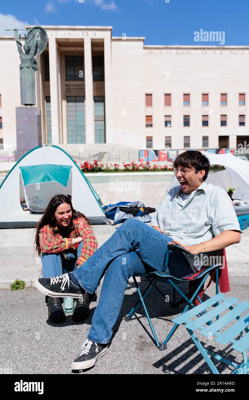 A group of students engage in discussion during a protest over rising ...