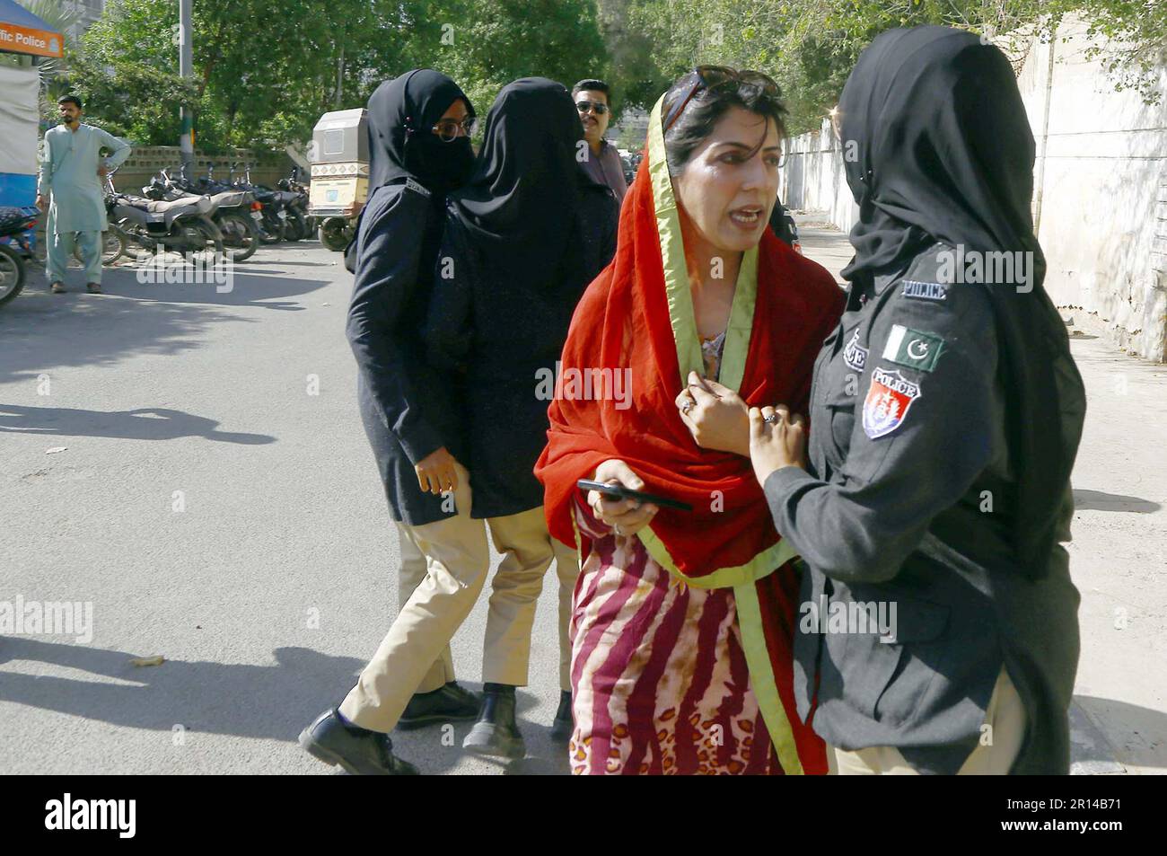 Karachi, Pakistan, May 11, 2023. Police officials restore baton charge ...