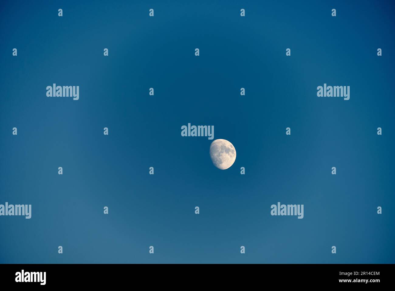 An almost full moon on a blue background. Background, contrasts, nobody ...