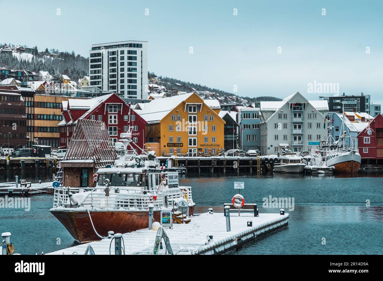 Tromso harbour, Norway, March 3rd 2022: Pier and traditional and new ...