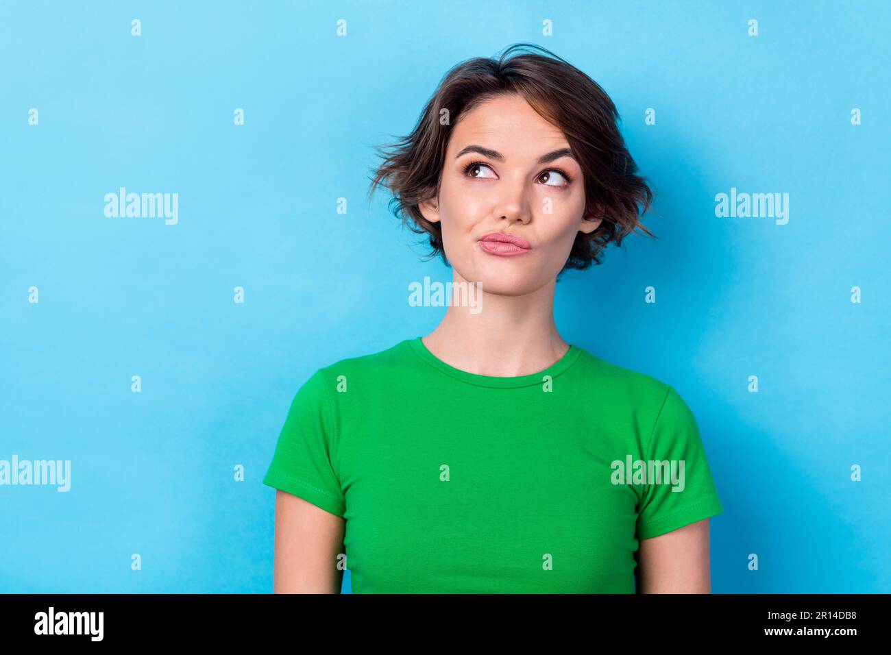 Photo of doubtful unsure woman dressed green top looking empty space ...