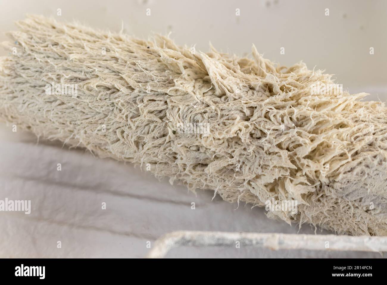 A close up view of a paint roll with white colour Stock Photo - Alamy