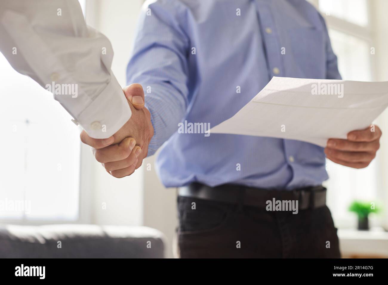 Two business people cooperate, meet in the office, make a deal and ...