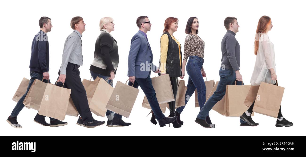 a group of people are running paper shopping bags Stock Photo - Alamy