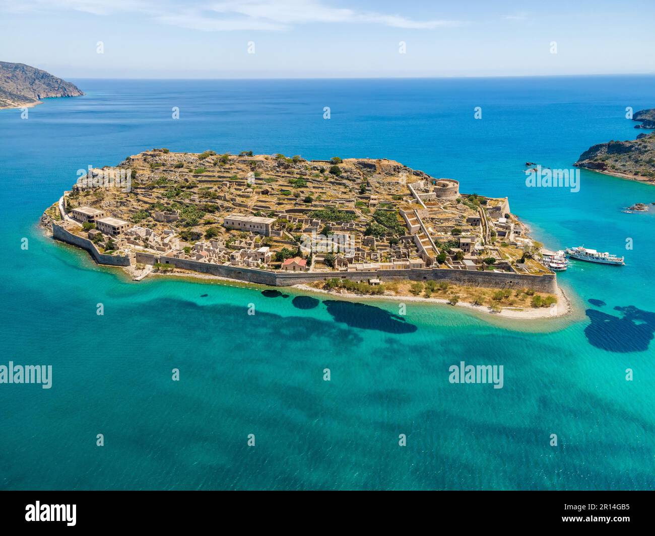 View of the fortress on the Spinalonga island with calm sea. Old ...