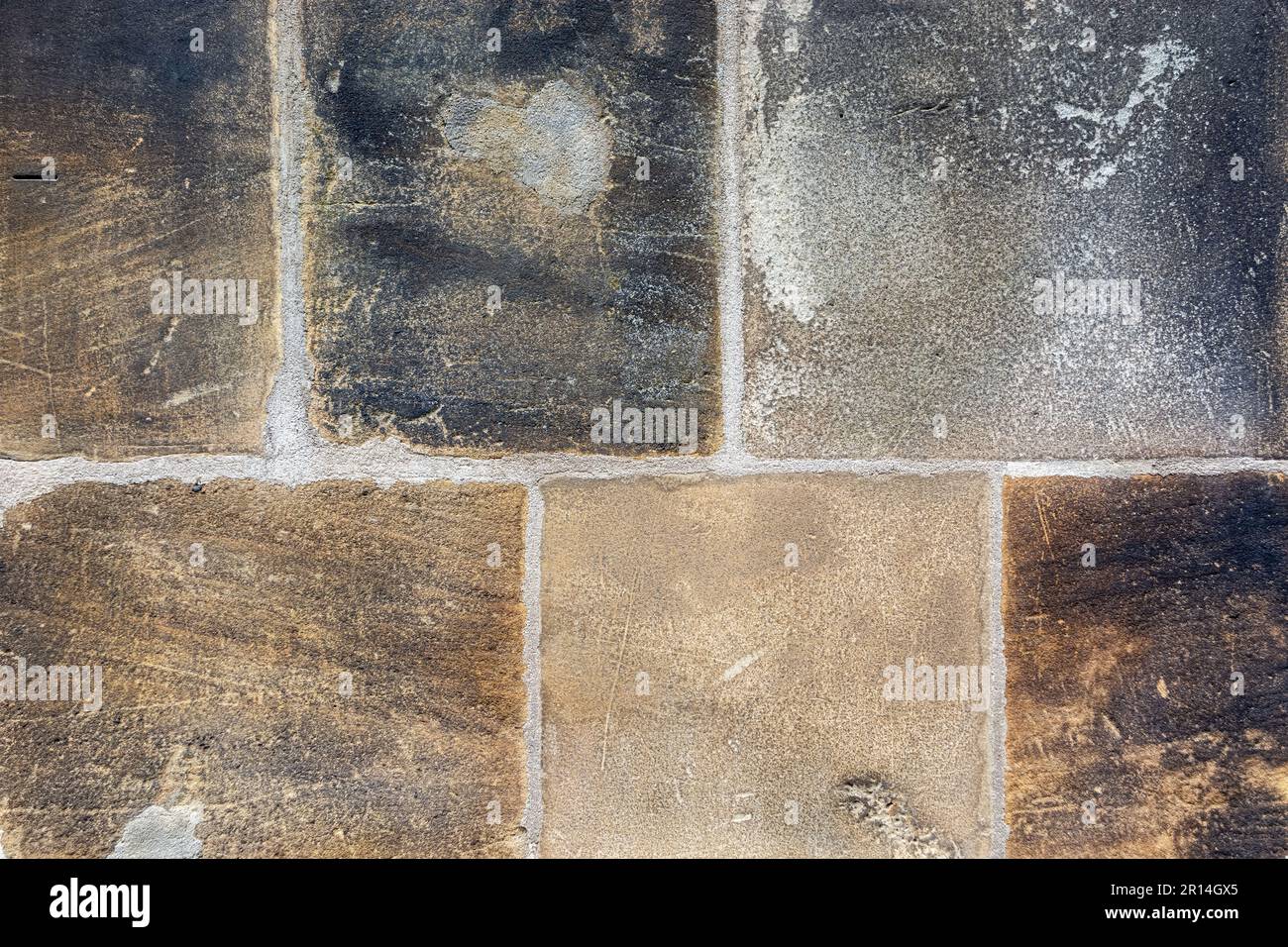Fragment of a wall made of rough-hewn stone blocks for use as an ...